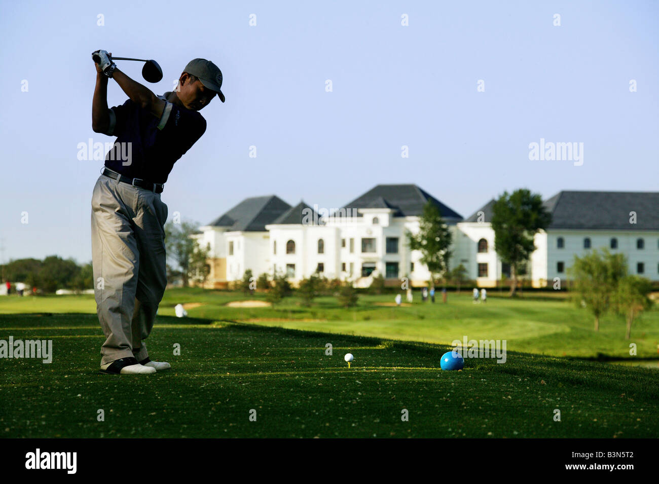 Chinese Man Playing Golf Stock Photo - Alamy