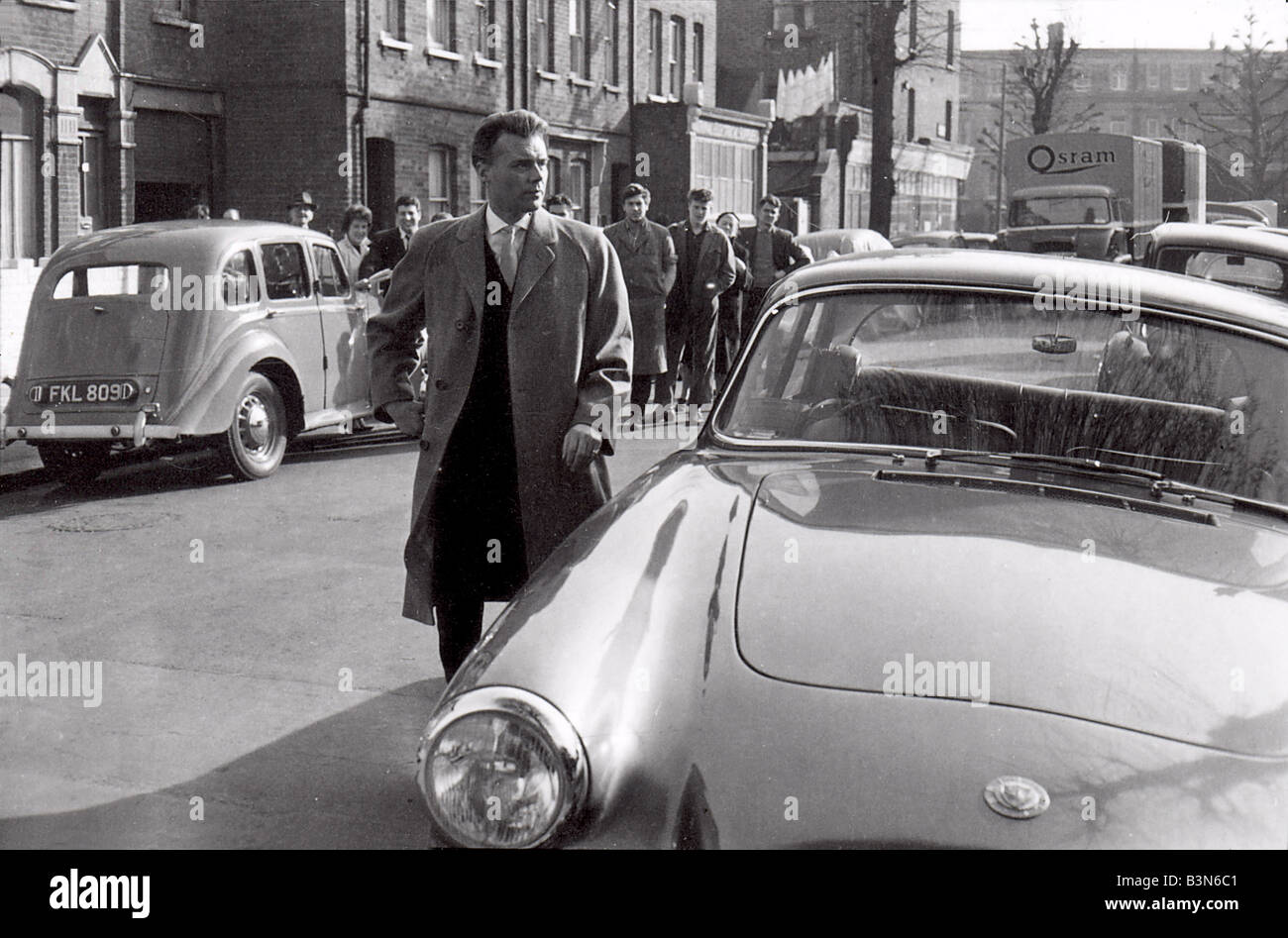 VICTIM crowds watch Dirk Bogarde during filming in London for 1961 Rank ...