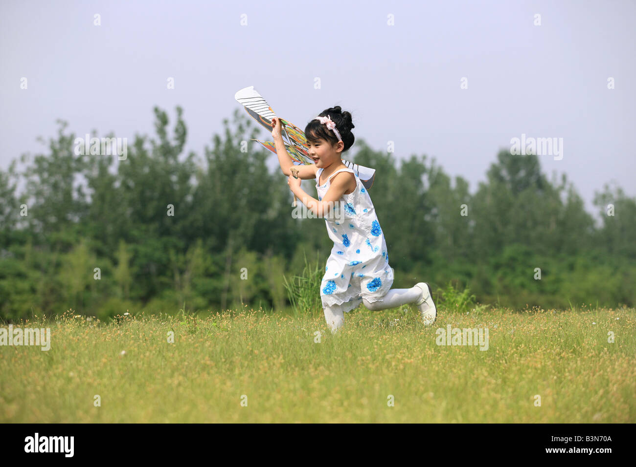 chinese girl flying kite,beijing Stock Photo - Alamy