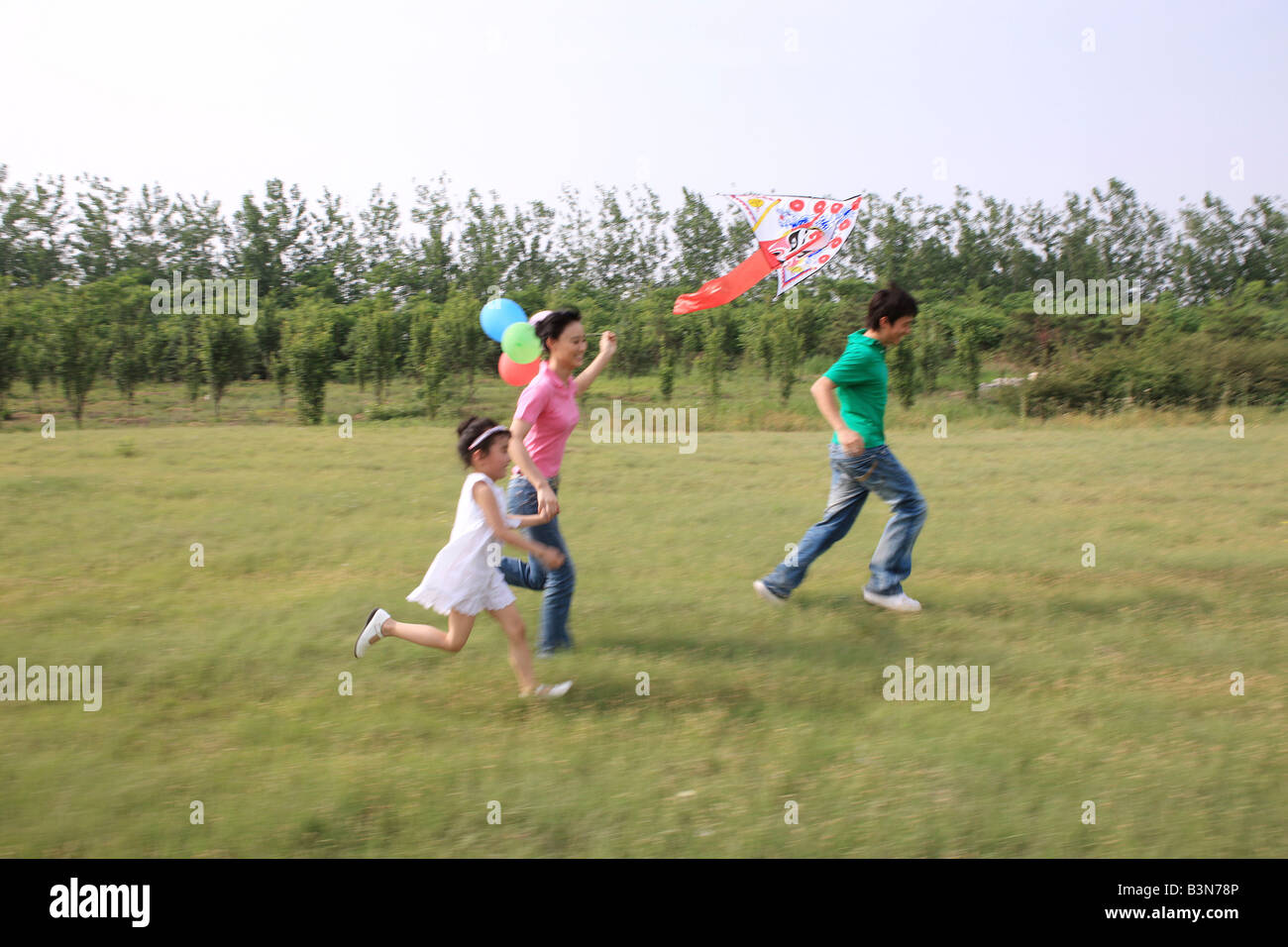 chinese family flying kite,beijing Stock Photo - Alamy