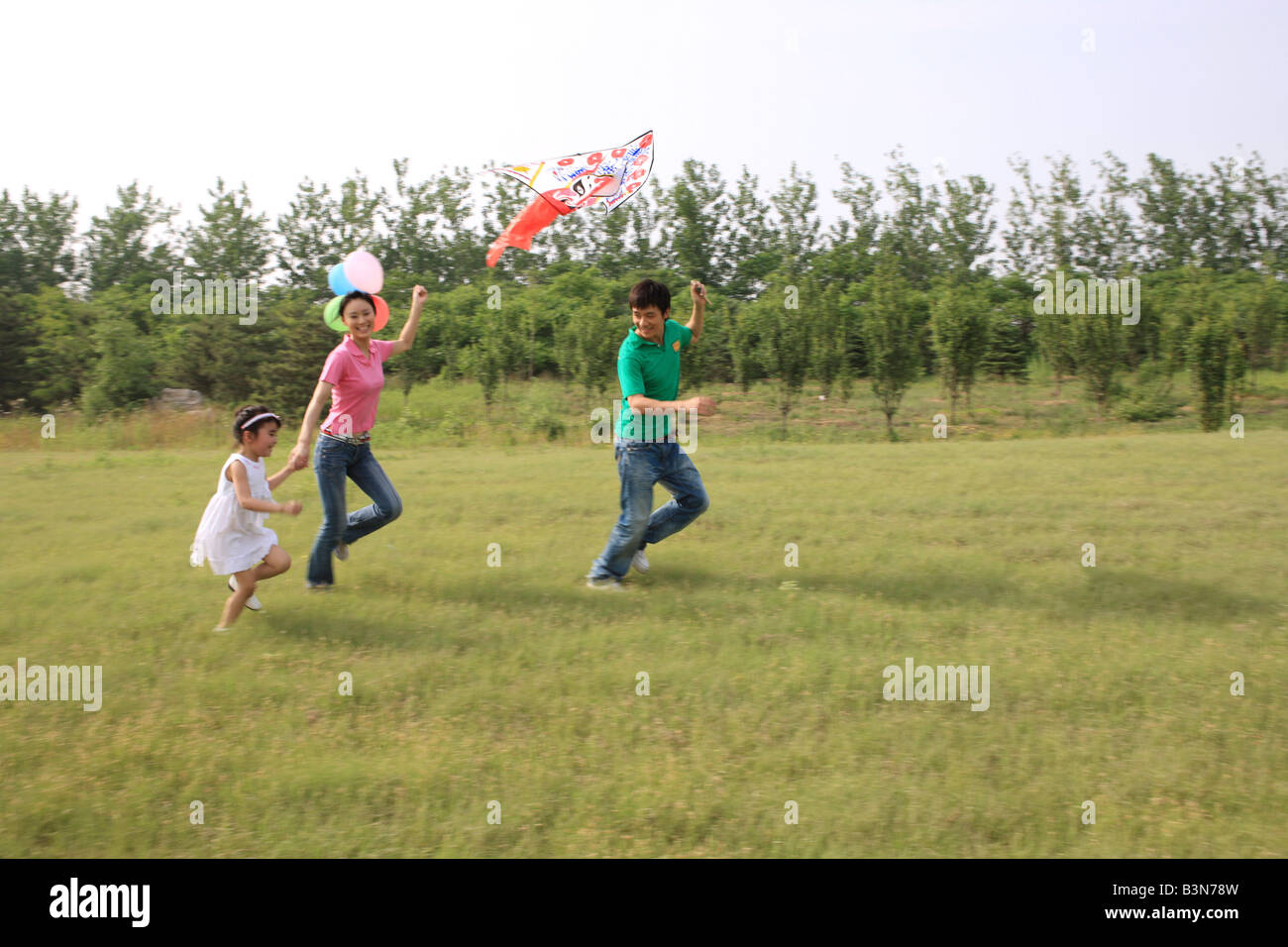 chinese family flying kite,beijing Stock Photo - Alamy