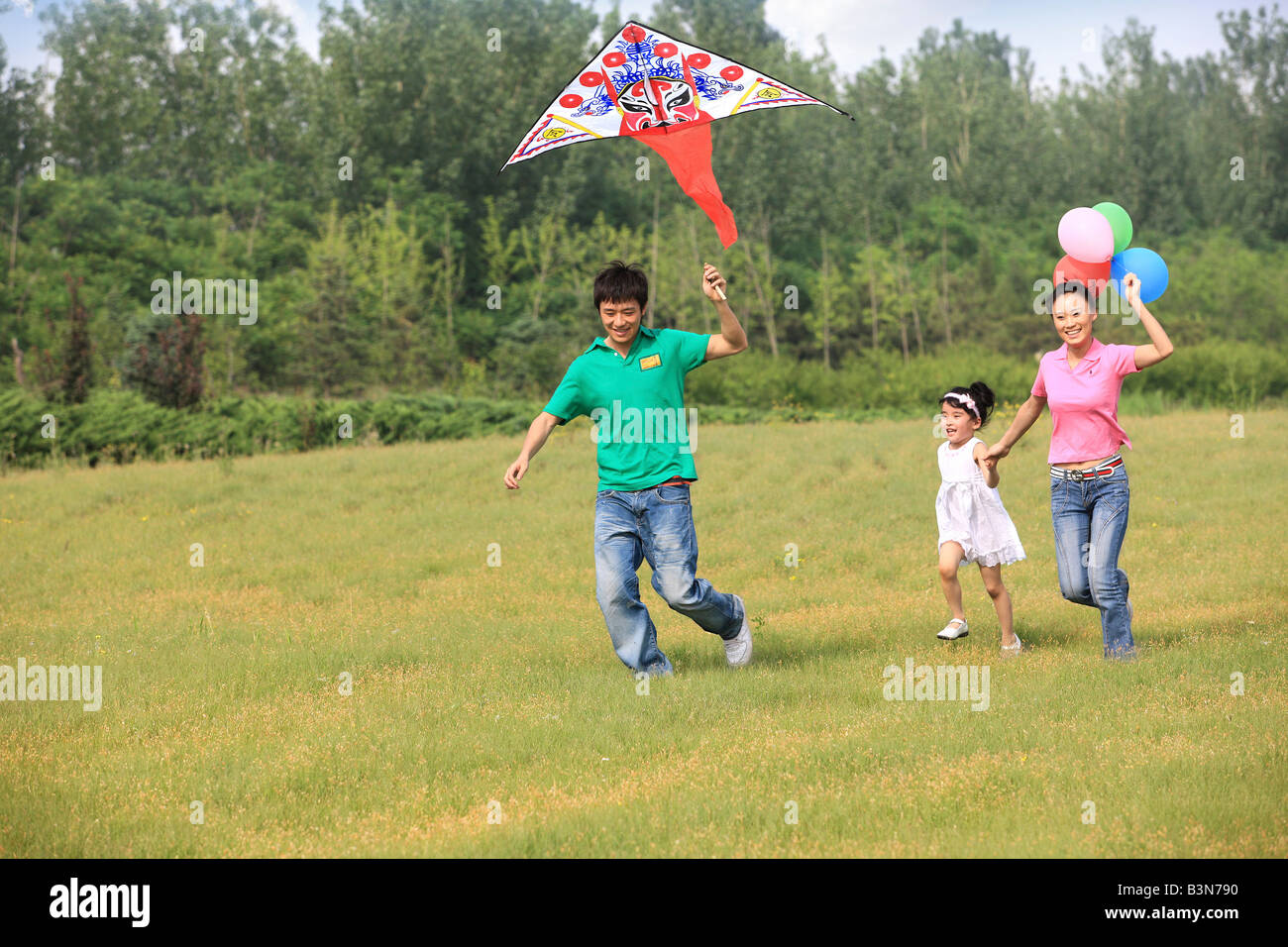 chinese family flying kite,beijing Stock Photo - Alamy