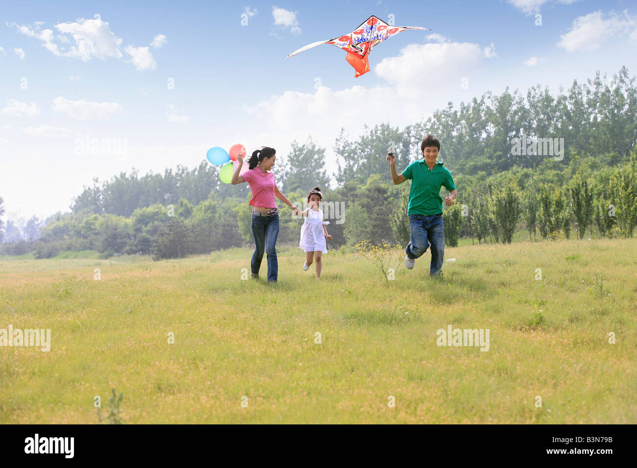 chinese family flying kite,beijing Stock Photo - Alamy