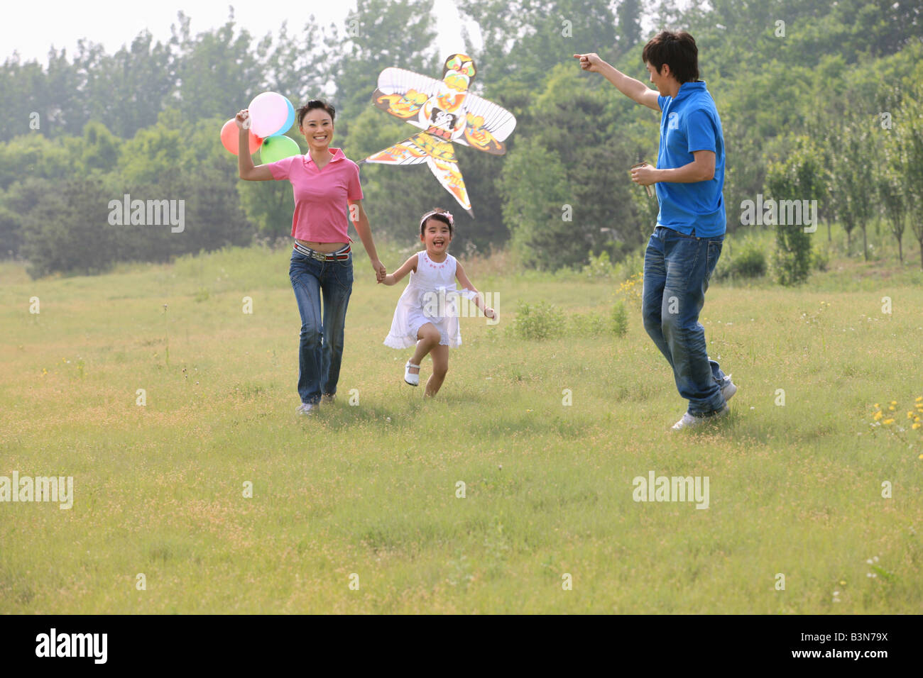 chinese family flying kite,beijing Stock Photo - Alamy