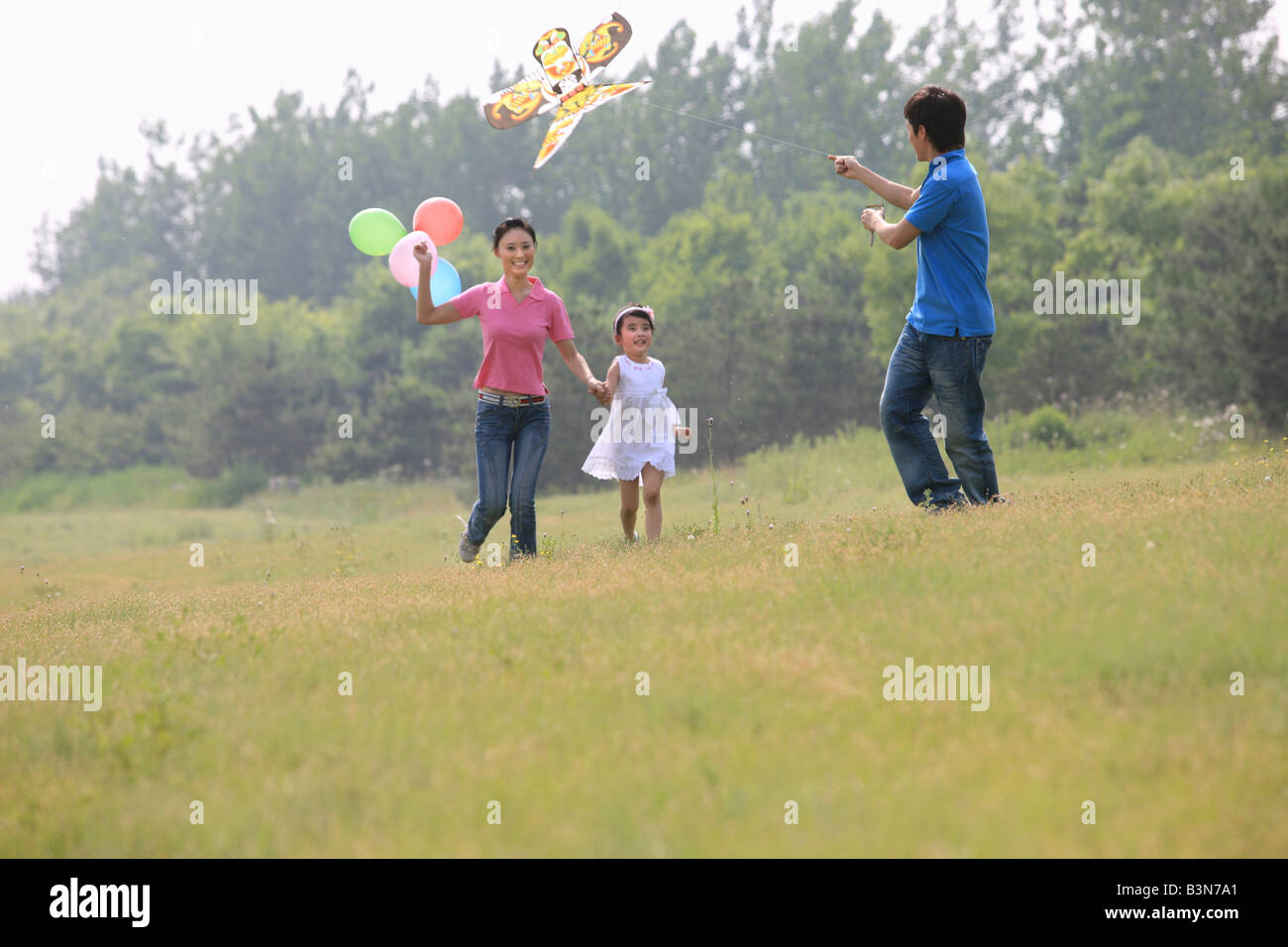 chinese family flying kite,beijing Stock Photo - Alamy