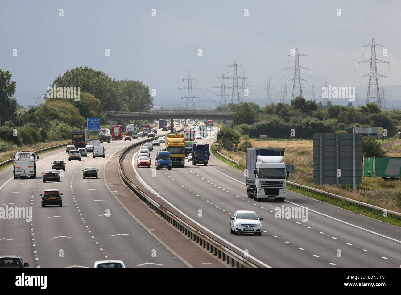 Keep apart 2 chevrons motorway road sign and markings on M56,Cheshire ...