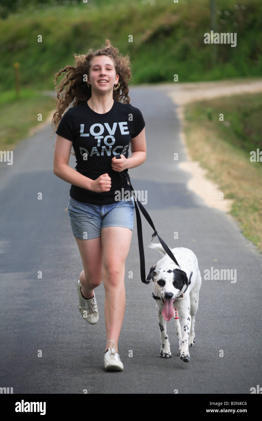 Teenage girl running Stock Photo - Alamy