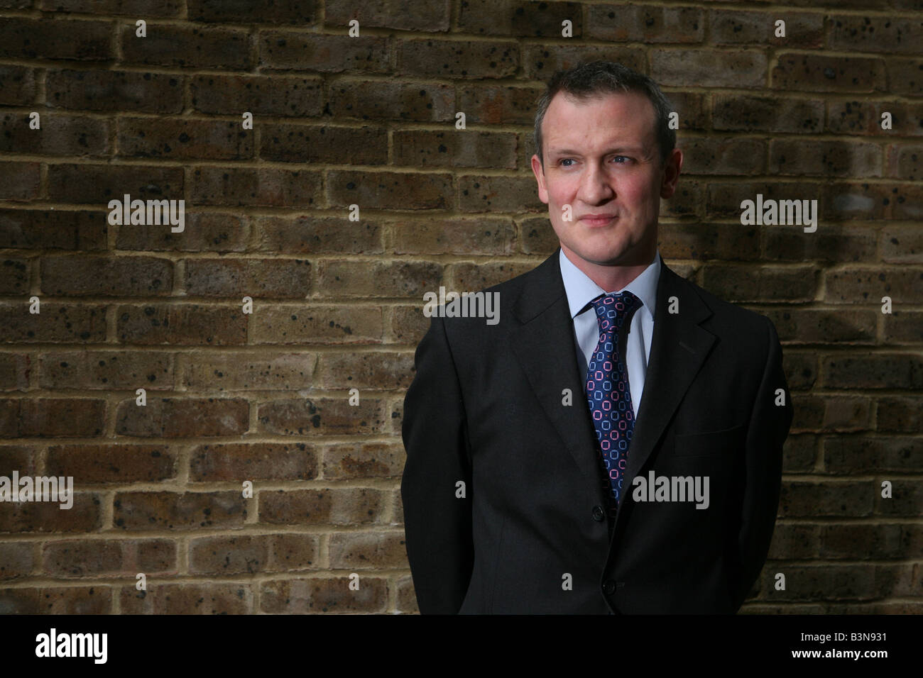 Portrait office man blue hi-res stock photography and images - Alamy