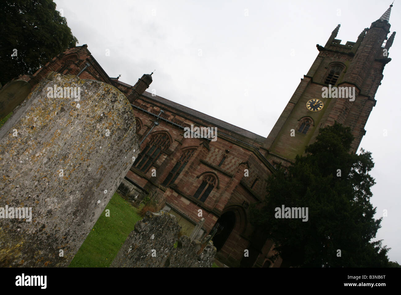 a sinister dark photo with a highlighted gravestone and a dark evil ...