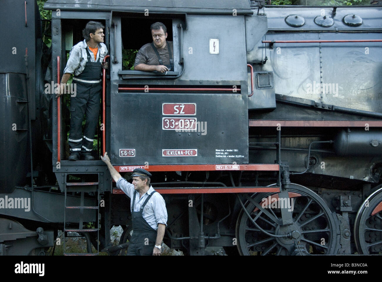 Train drivers on Slovenian steam locomotive at Bled Jezero Station ...