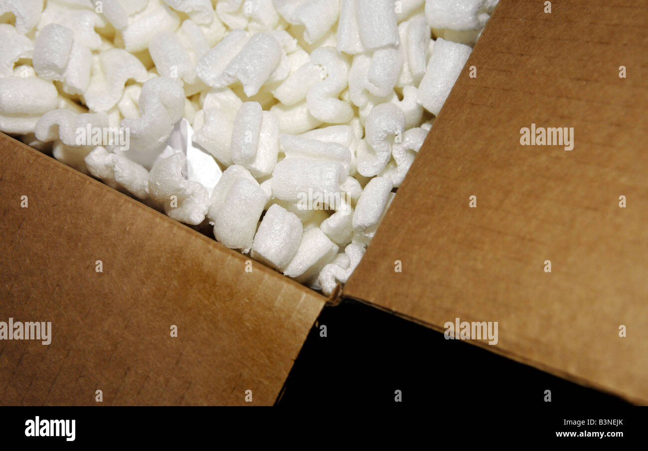 Packing peanuts in cardboard box Stock Photo - Alamy