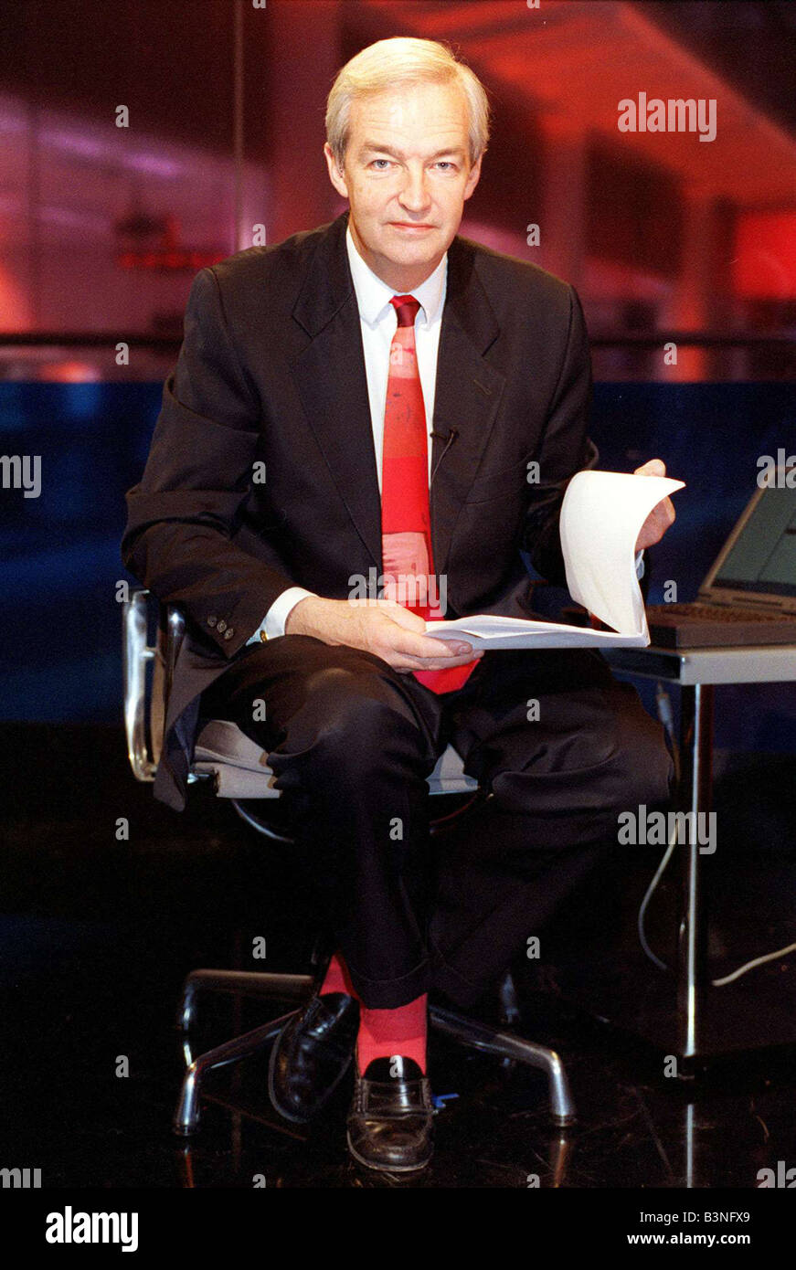 Jon Snow TV Presenter December 1998 Cahnnel 4 newscaster sitting on his ...