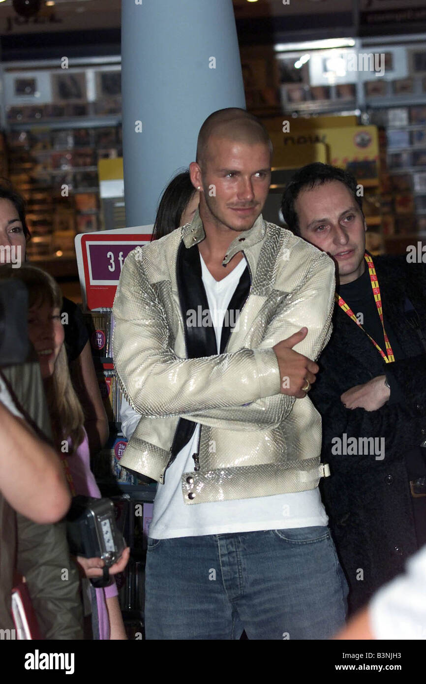 David Beckham August 2000 Watching wife Victoria sign copies promoting ...