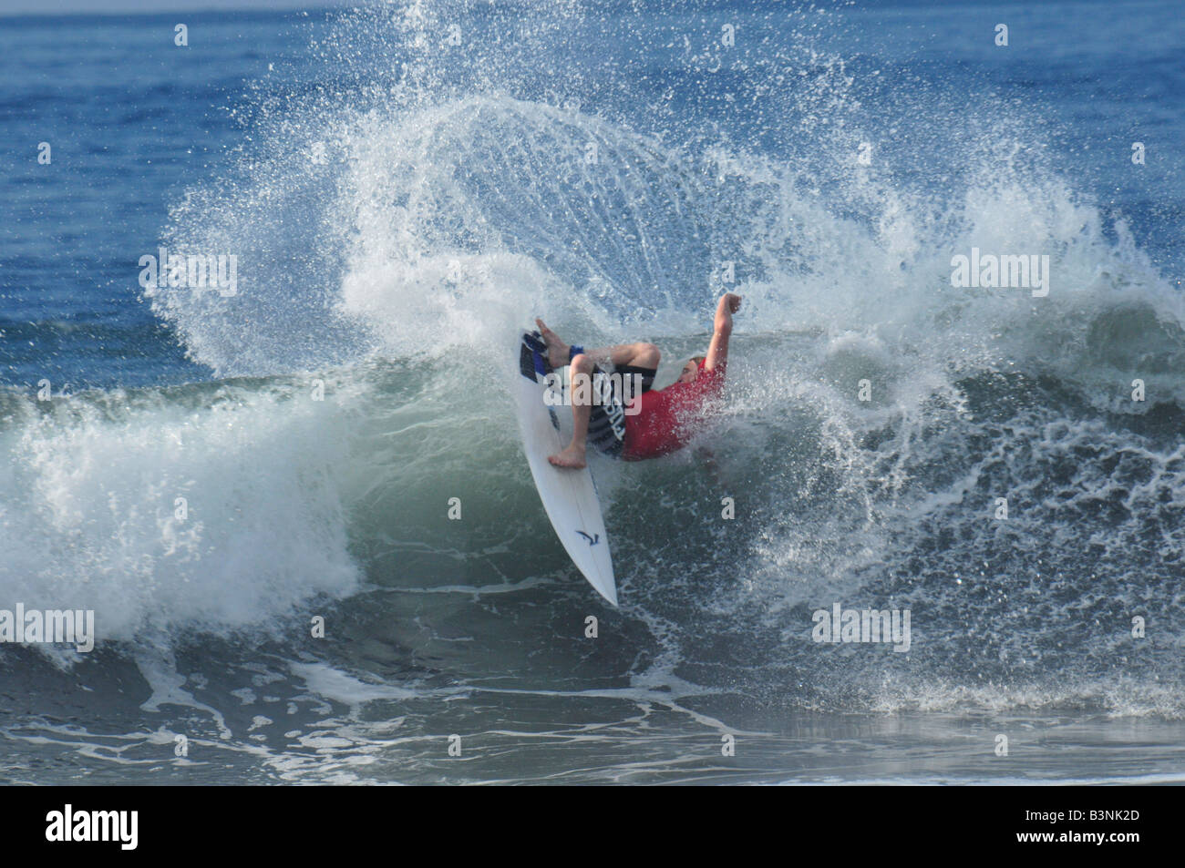 Surfer riding a wave, Kuta Beach, Bali, Indonesia Stock Photo - Alamy