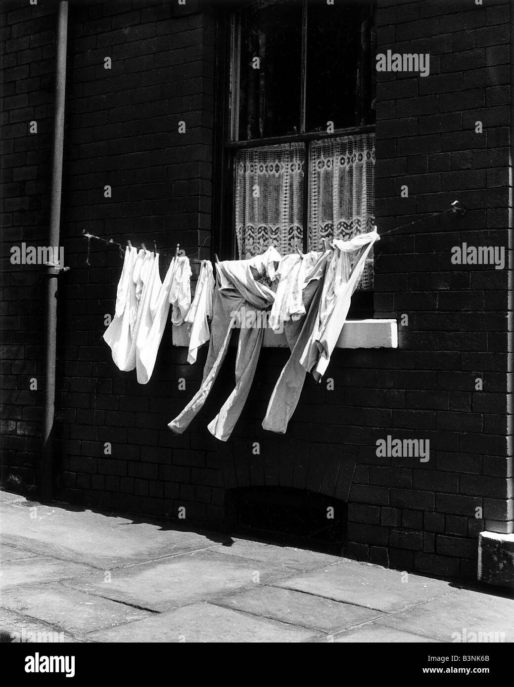A washing line near a terrace house in Manchester Date unknown Stock ...