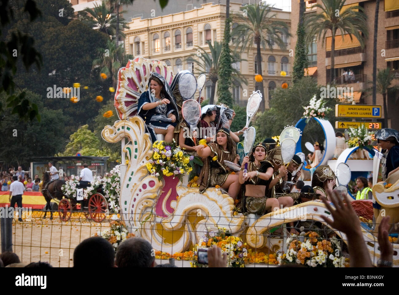 Spanish woman in costume on a float during the Battle of Flowers or ...