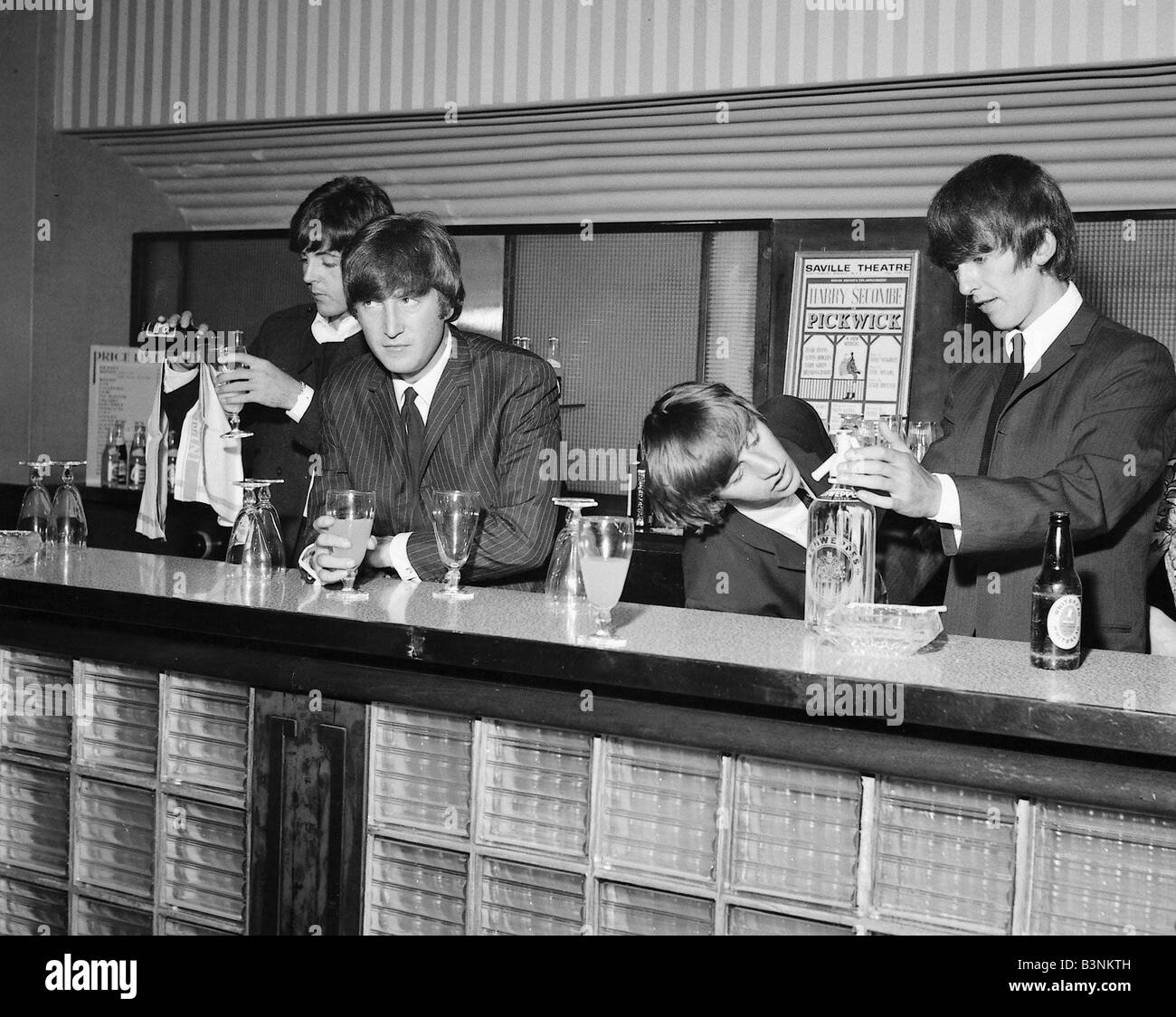 Beatles 1964 The Beatles help themselves to the drinks bar at Saville ...
