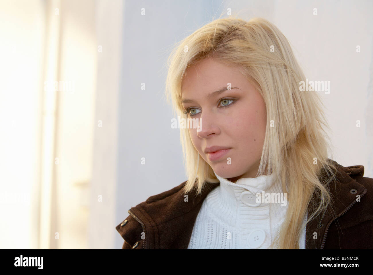 Teenage girl contemplating outdoors, looking away Stock Photo - Alamy