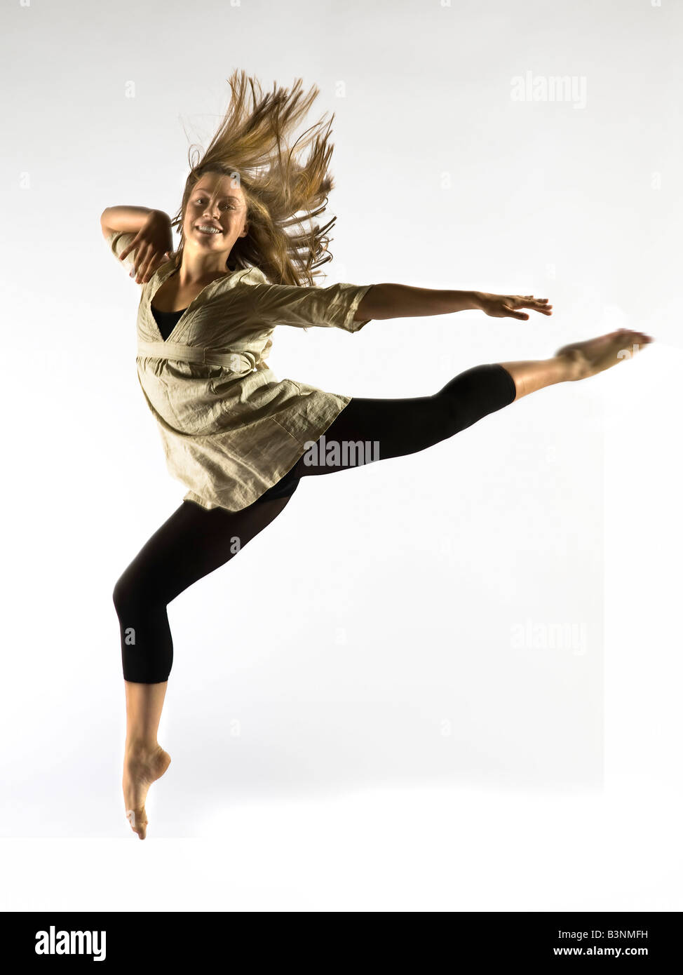 female teenager jumping smiling,professional,accomplished,posed,working ...