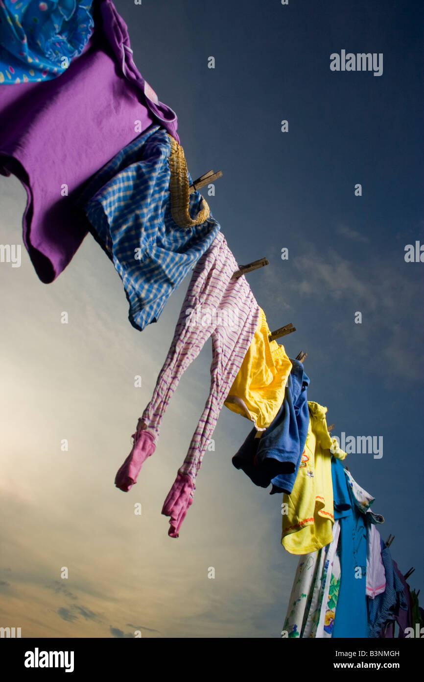 Hanging out clothes to dry on the line Stock Photo - Alamy