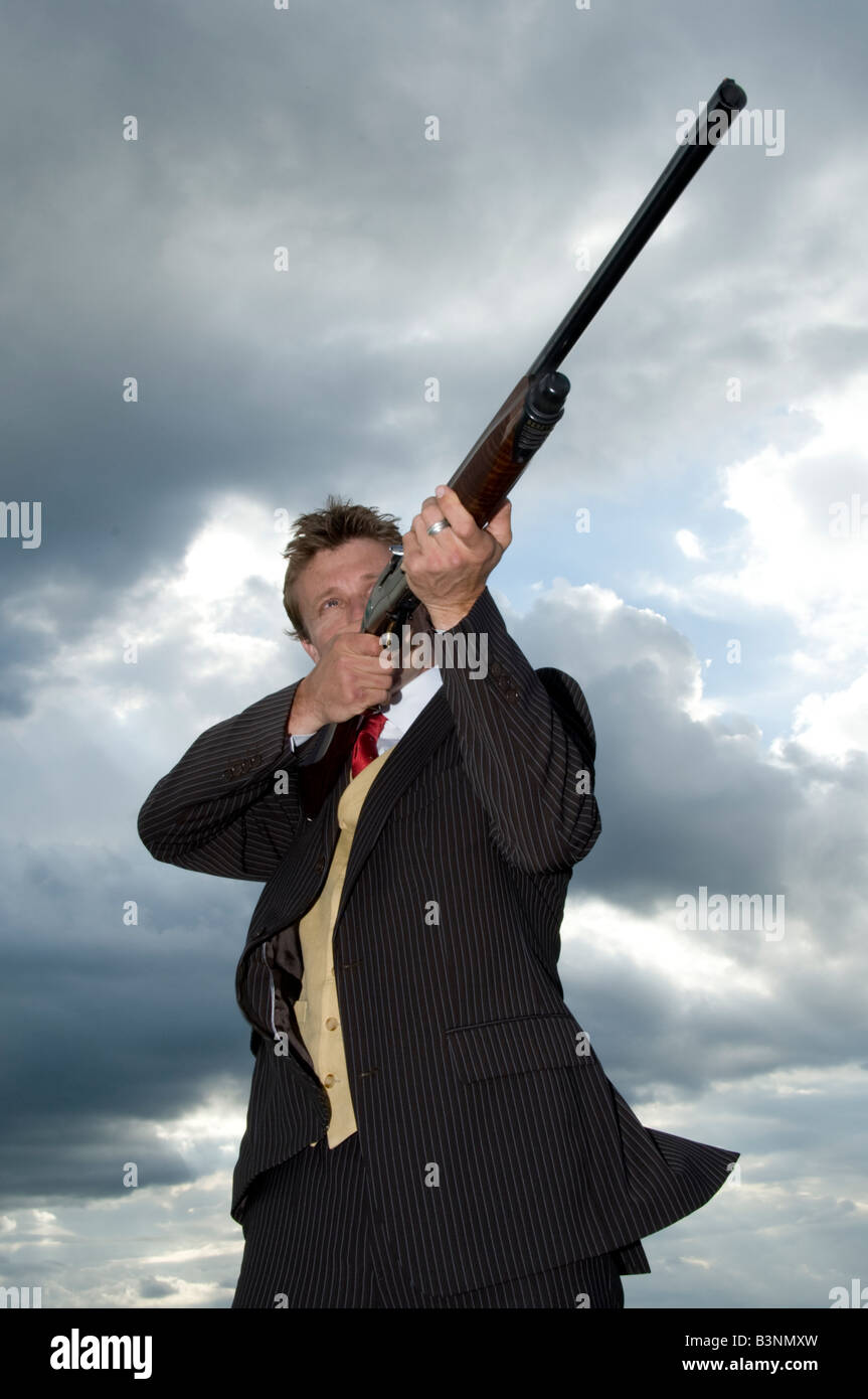 Business man golf club gun hi-res stock photography and images - Alamy