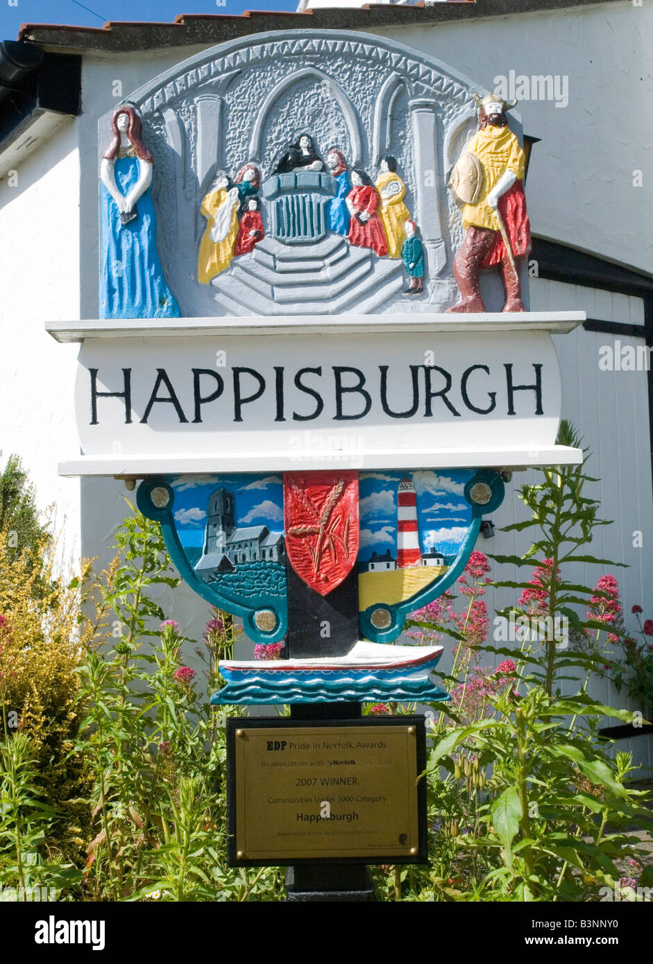 A sign at the entrance to the village of Happisburgh, Norfolk East ...