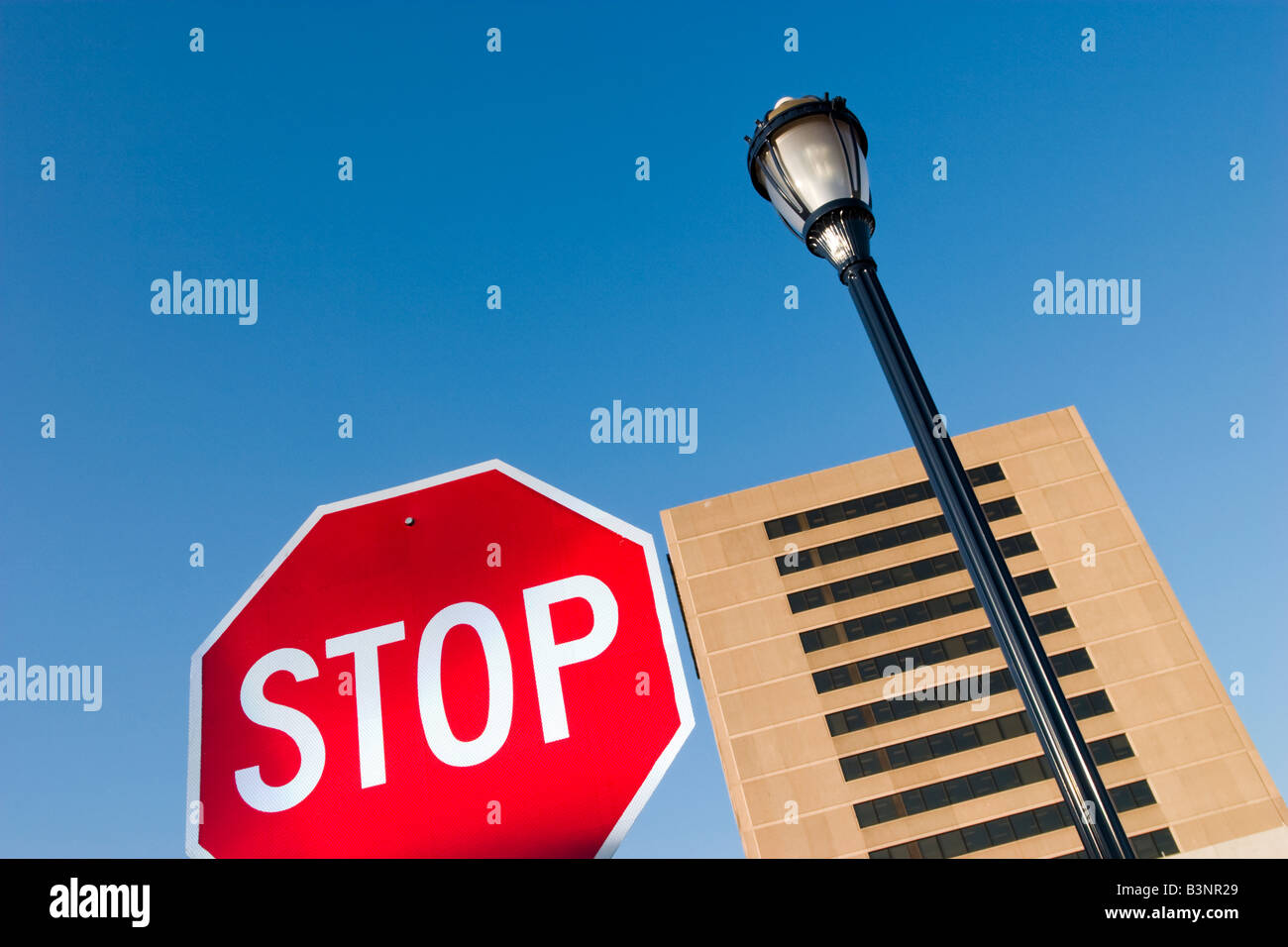 Stop sign in front of a building and lamppost in downtown Hartford ...