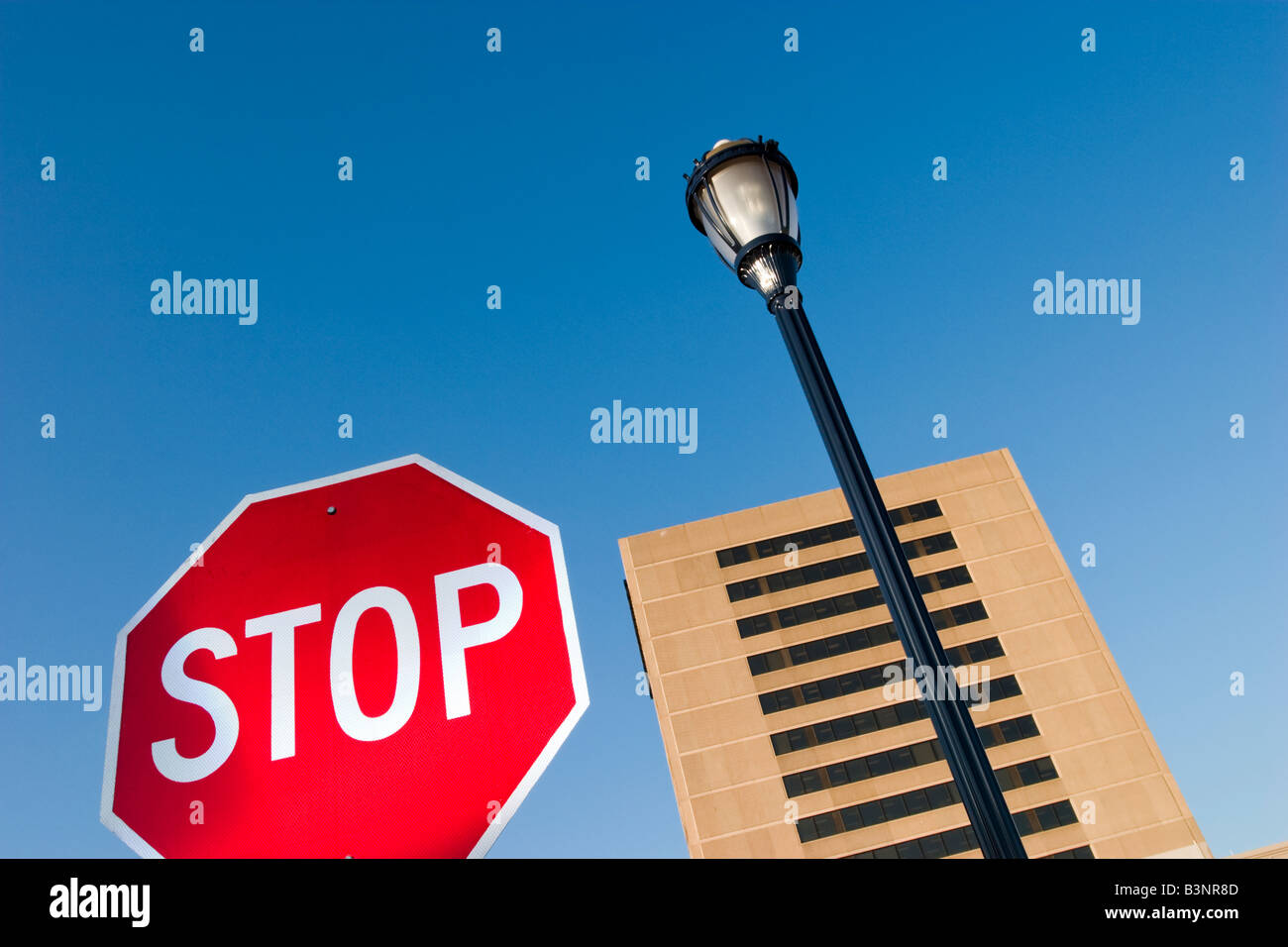 Stop sign in front of a building and lamppost in downtown Hartford ...