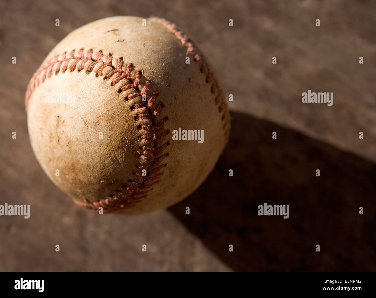 A scuffed and used baseball after hard use Stock Photo - Alamy