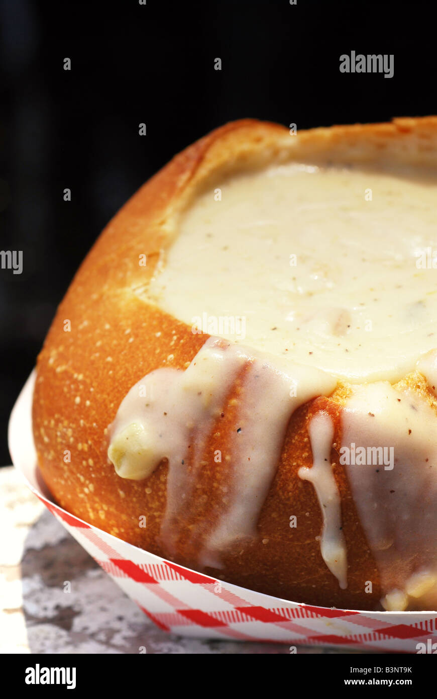 Clam chowder in a sourdough bread bowl on a wooden fishing dock Stock ...