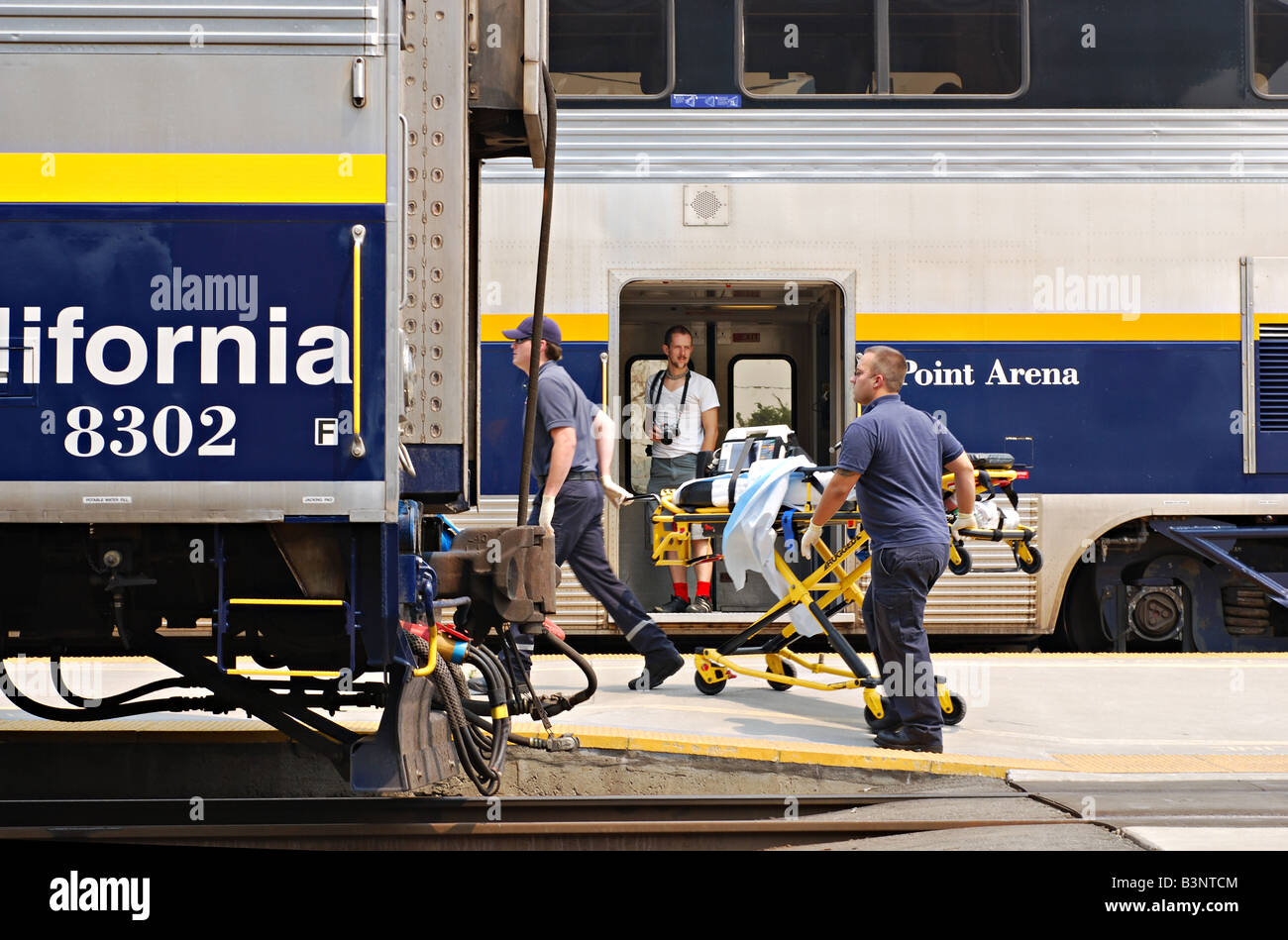Paramedics arrive at a train station to attend to a health emergency ...