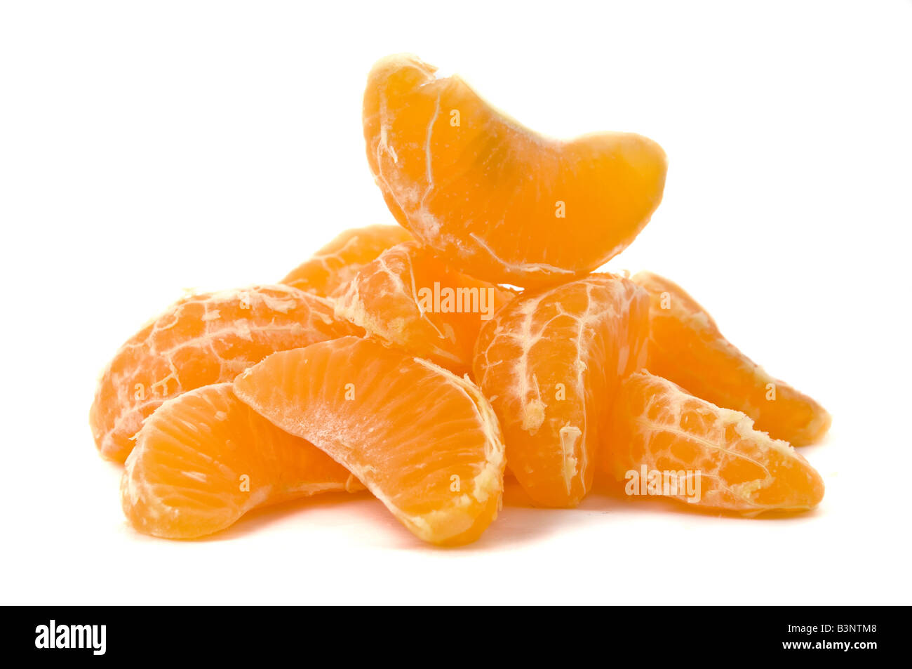 Orange segments on white background Stock Photo - Alamy