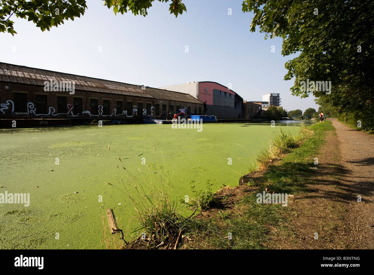 London 2012 Pathway along the river Lea, in front of warehouses in the ...