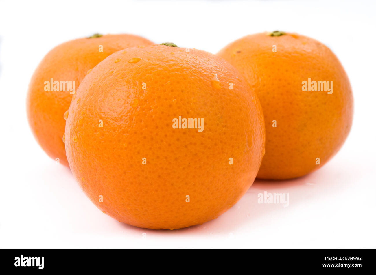 Oranges isolated on white Cut Out Stock Images & Pictures - Alamy