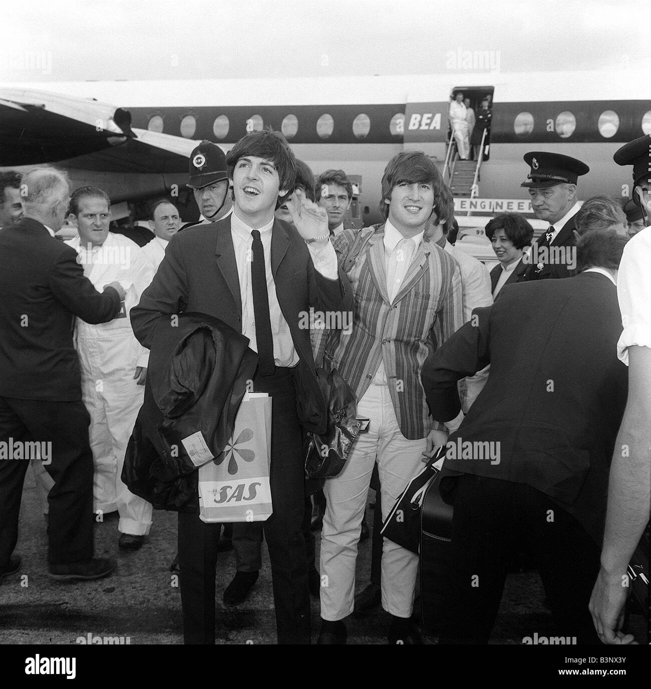 The Beatles July 1964 John Lennon and Paul McCartney leaving their ...