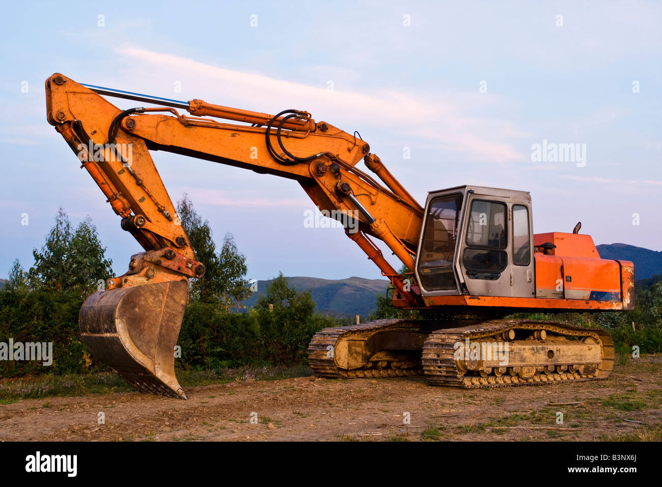 A big orange bulldozer at construction site Stock Photo - Alamy