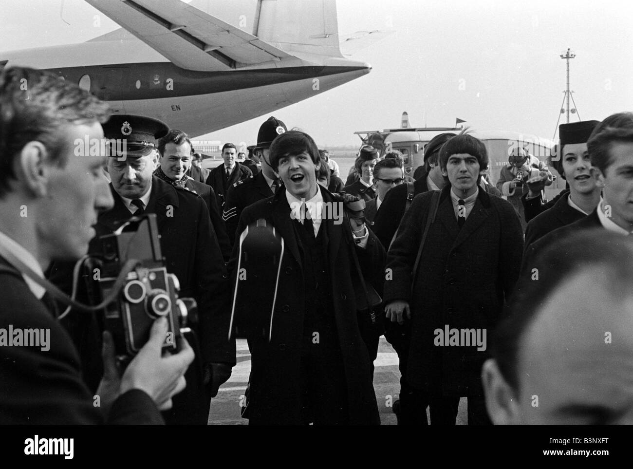The Beatles February 1964 The Beatles arrive back in London from Paris ...
