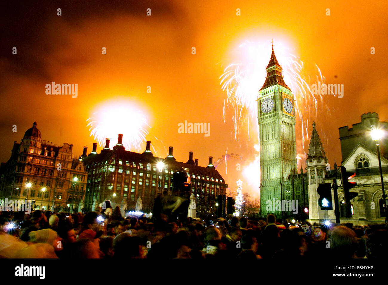 A firework display lights up Big Ben January 2000 as part of the ...