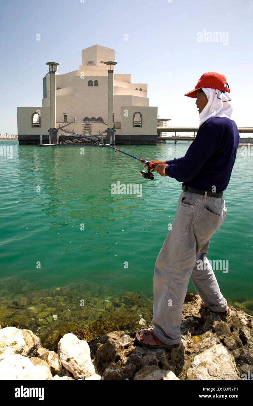 Man Fishing with the background of New Museum of Islamic Art in Doha ...