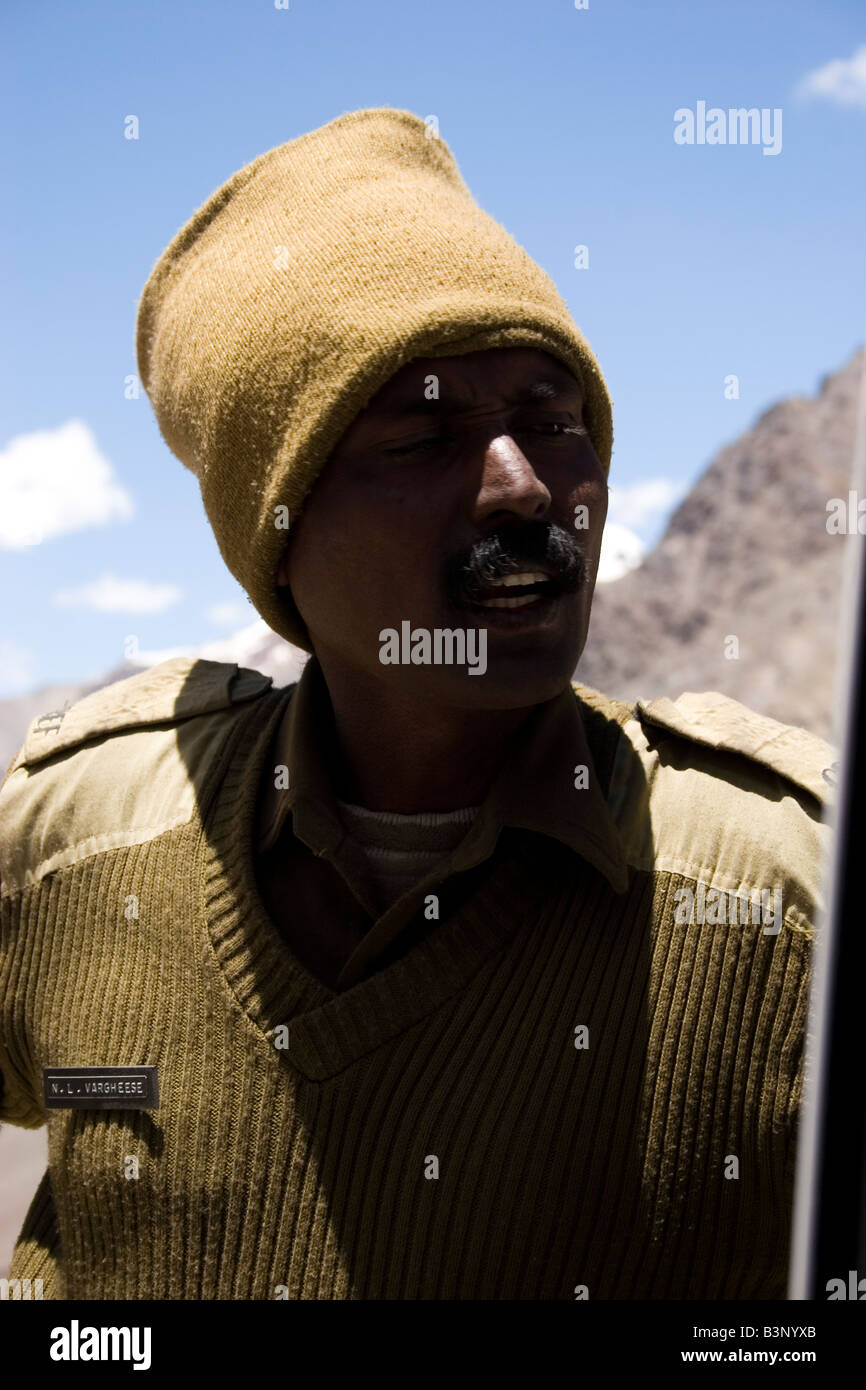 Military local man on road with mountain on background Stock Photo - Alamy