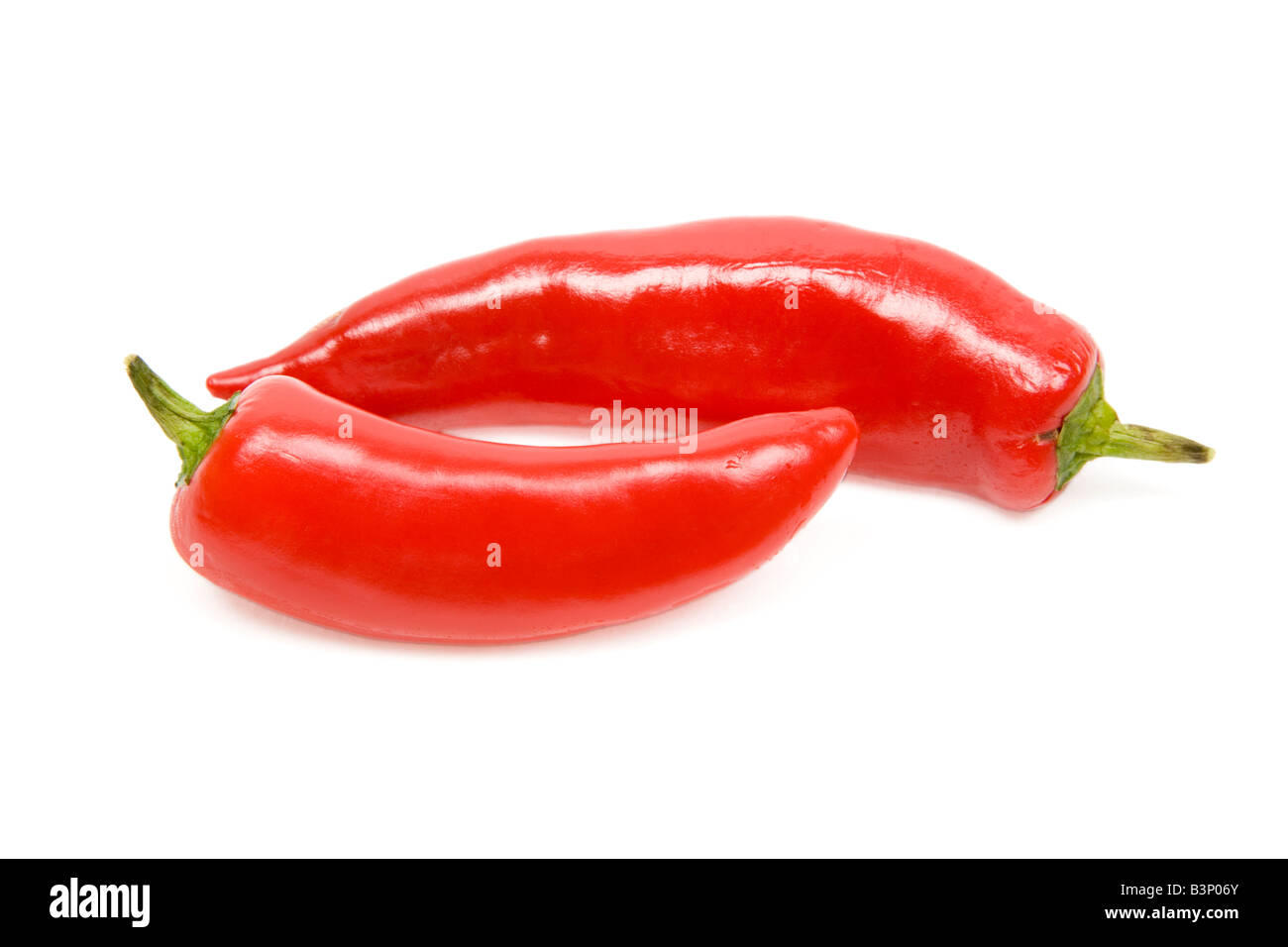 Two red chilli peppers Stock Photo - Alamy