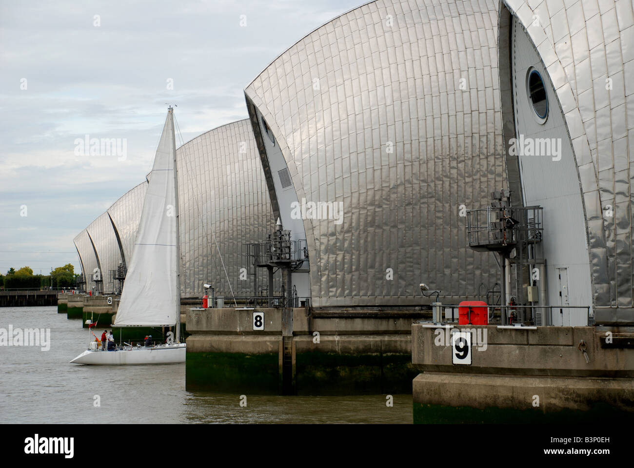 Sail boat passing through The Thames Barrier, London, UK, Europe Stock ...