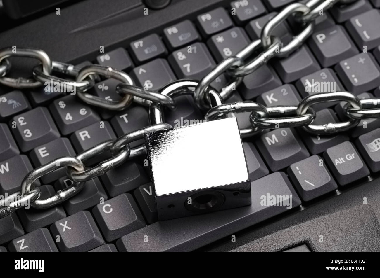 Padlock and Chain on Laptop Computer Keyboard Stock Photo - Alamy Padlock and Chain on Laptop Computer Keyboard Stock Photo - Alamy