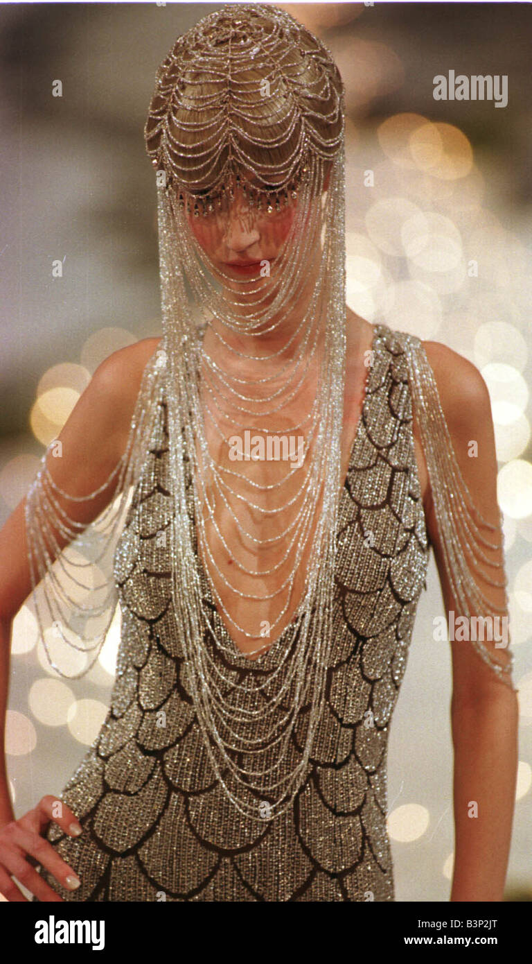 Clothing by Givenchy 1998 model wearing Givenchy designed dress walking ...