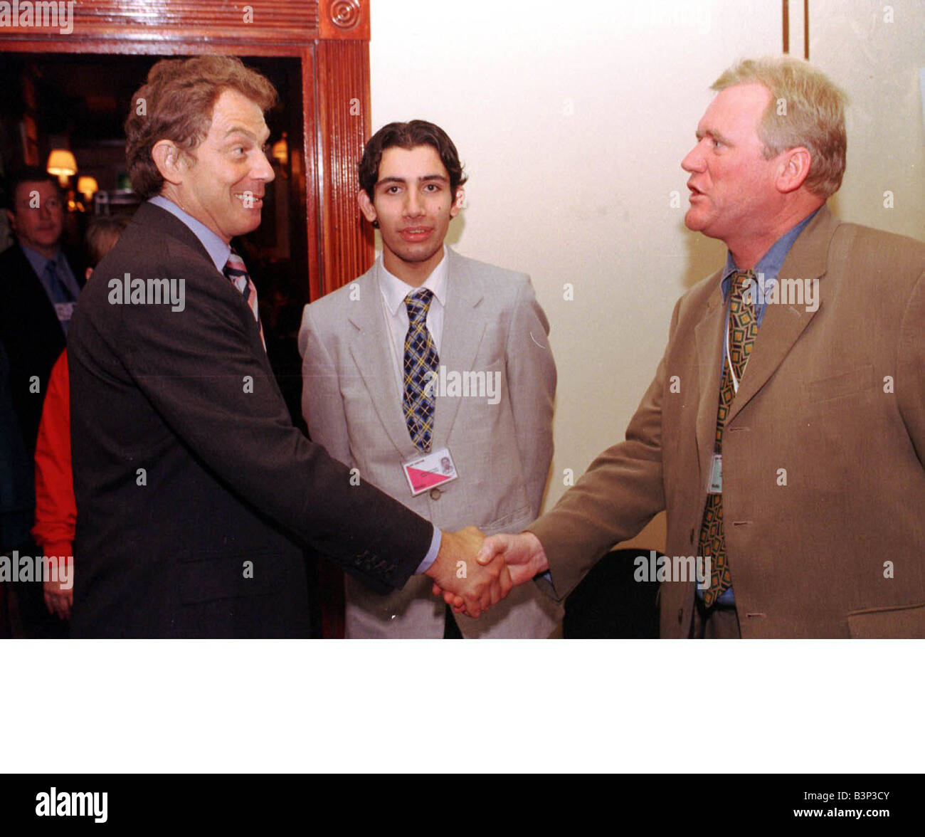 Tony Blair shakes hands with Bob Shields as Alan Cheyne looks on ...