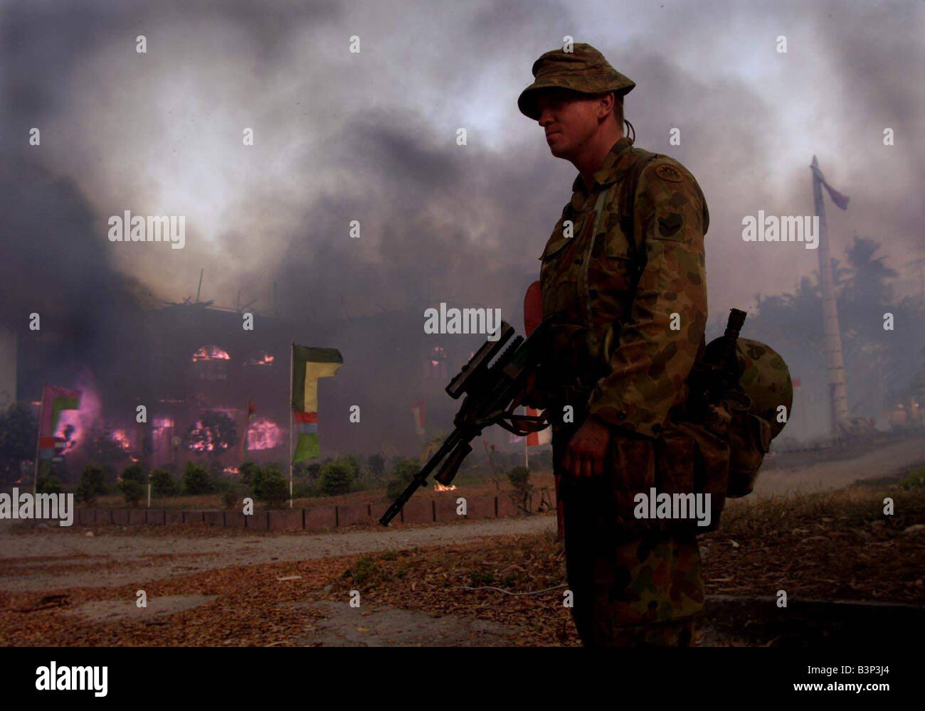 Indonesian Army burn their HQ as they leave Dilli Soldier holding ...