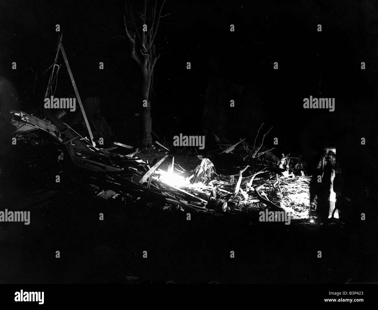 WW2 Air Raid V2 Bomb Damage July 1944 Rescue workers use flood lights ...