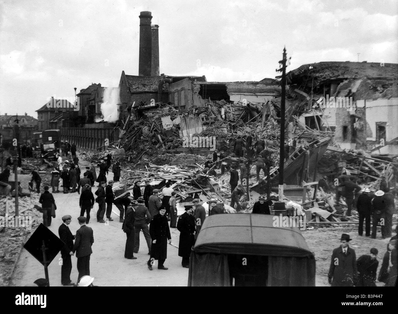 WW2 Air Raid Damage February 1945 Rocket raid at Ilford V2 People stand ...