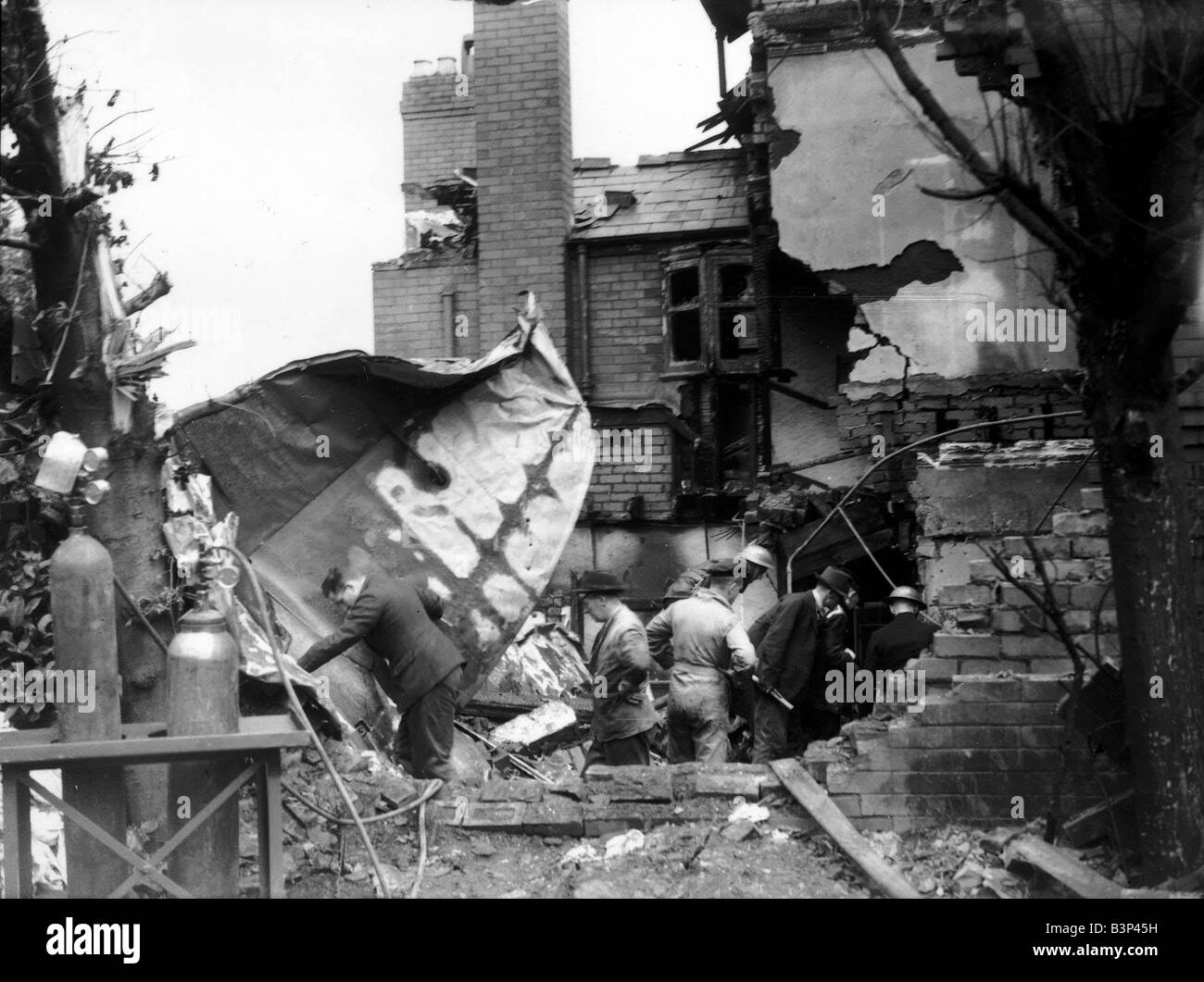 WW2 Air Raid Damage Rescue workers searching a bombed building after a ...
