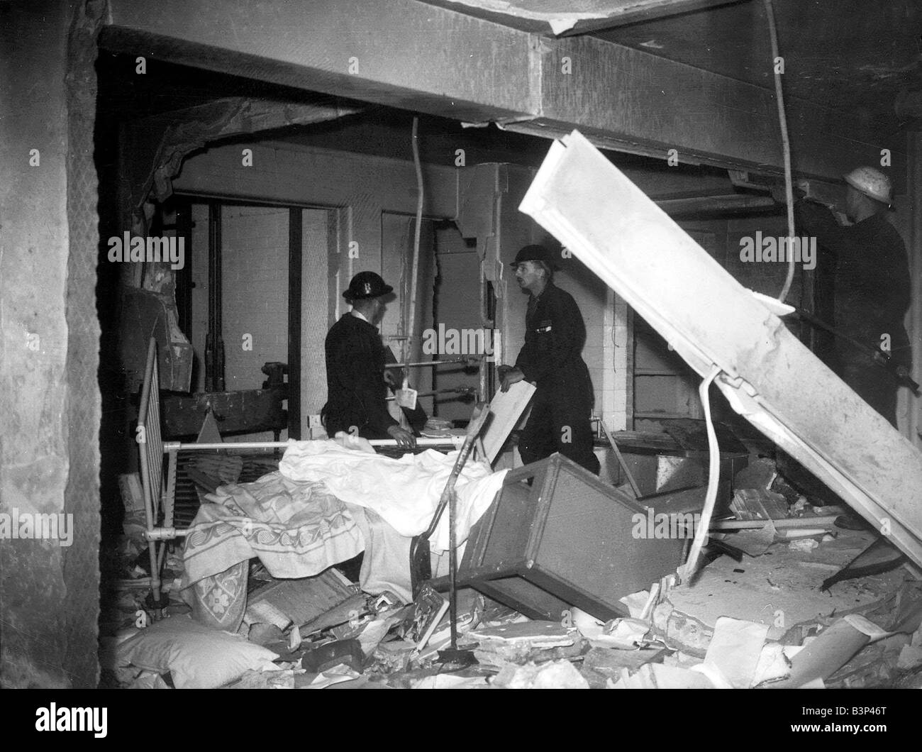 WW2 Air Raid Damage Rescue worker in the wreckage of a bombed hospital ...